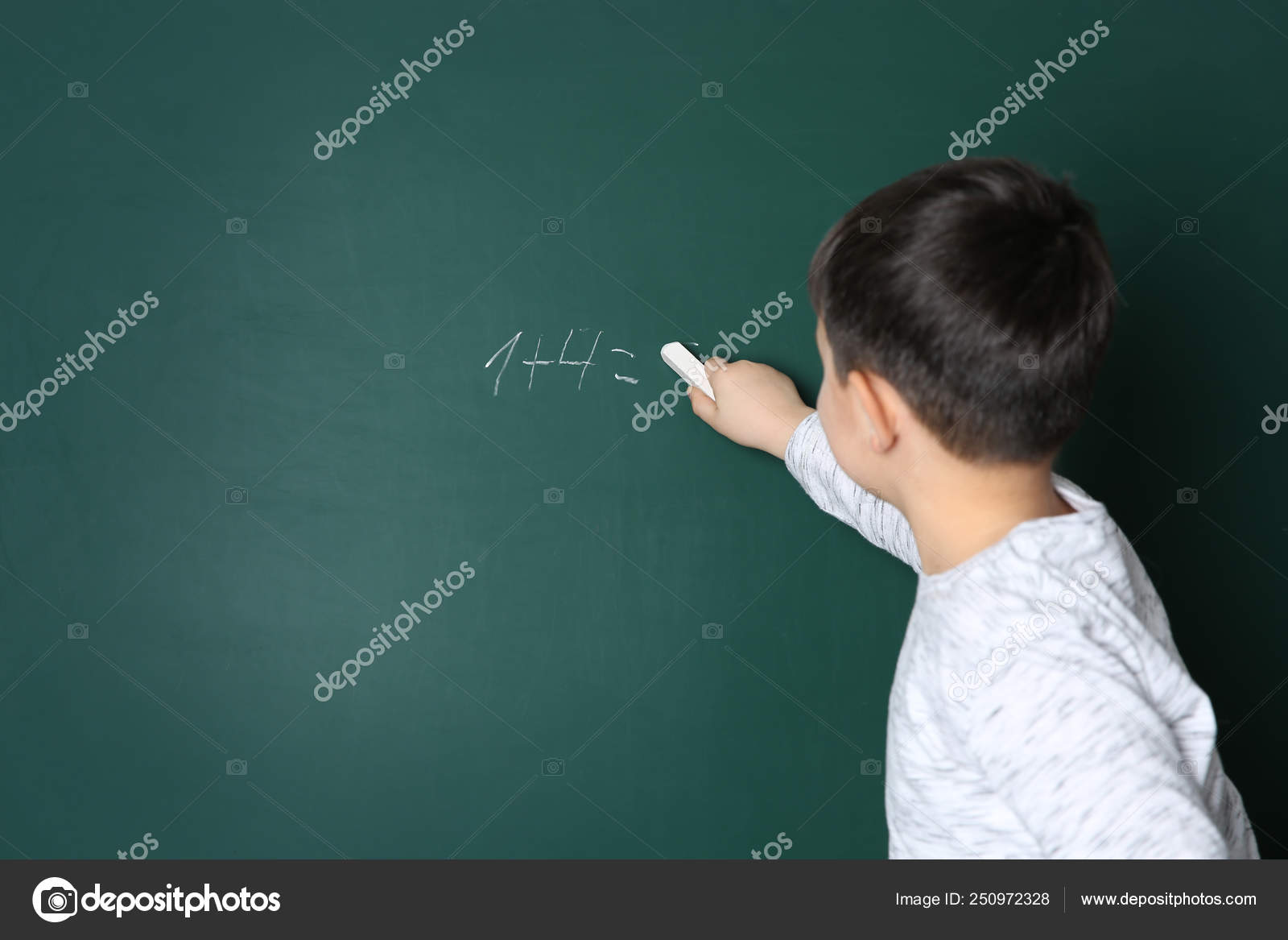 Child writing math sum on chalkboard. Space for text Stock Photo by ...