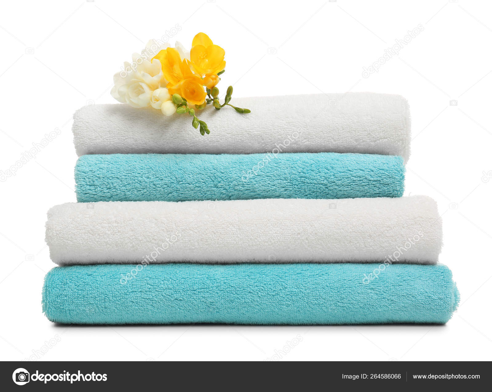 Stack of clean folded towels with flowers on white background Stock ...