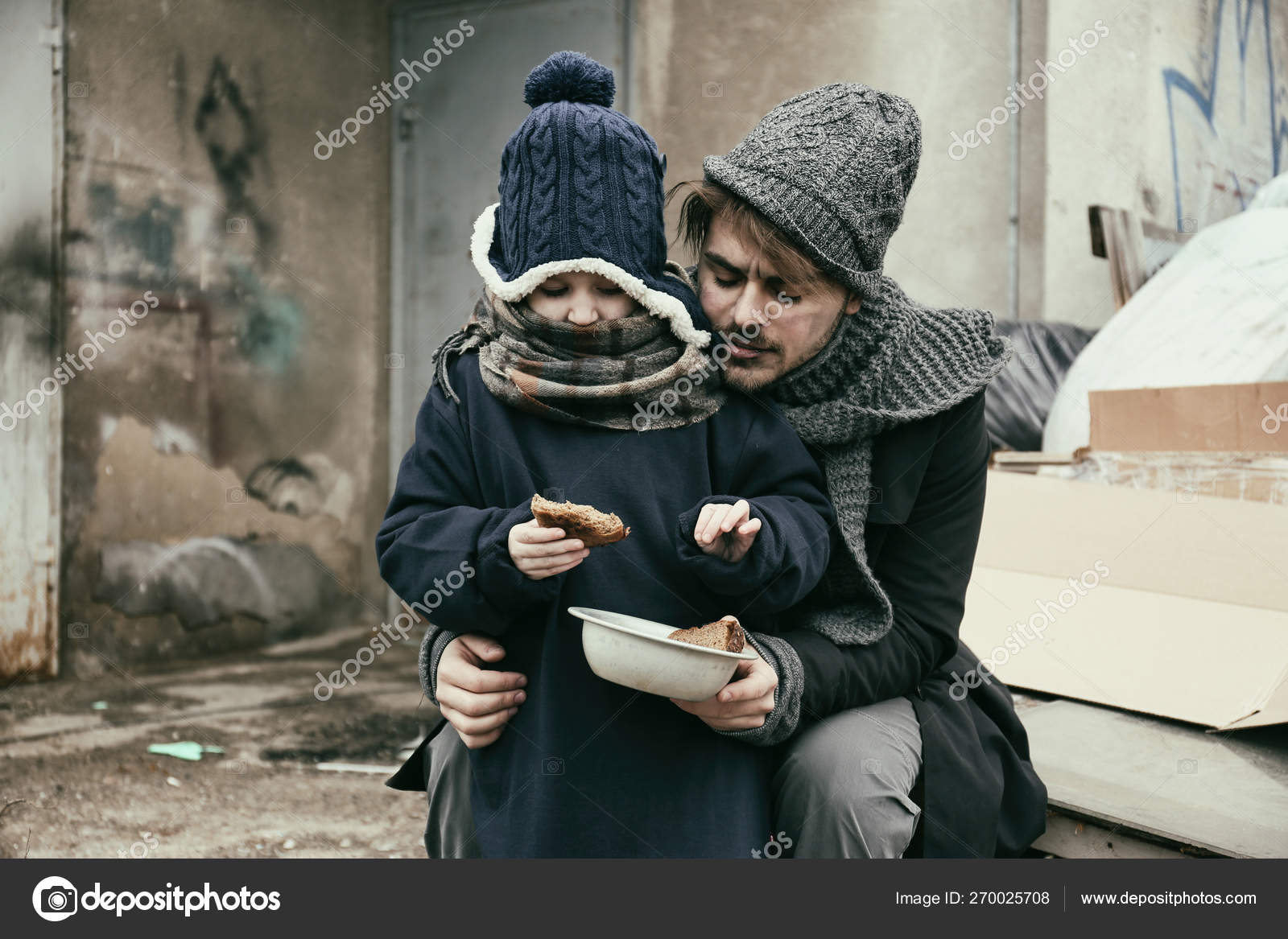 Poor father and child with bread at dump — Stock Photo © NewAfrica ...