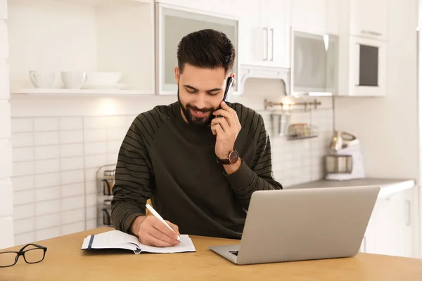 Man Calculating Taxes Table Room — Stock Photo © NewAfrica #691018244