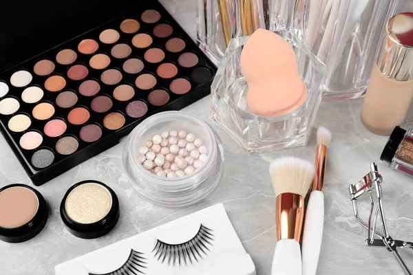 Set of different professional makeup products on table - Stock Image ...