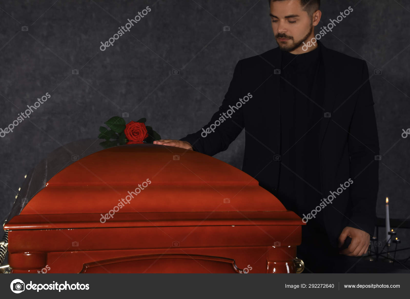 Young man near casket with red rose in funeral home, closeup — Stock ...