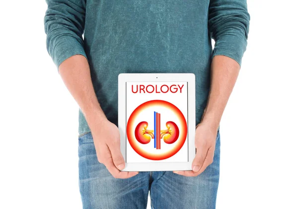 Man holding tablet with word UROLOGY on screen against white background ...
