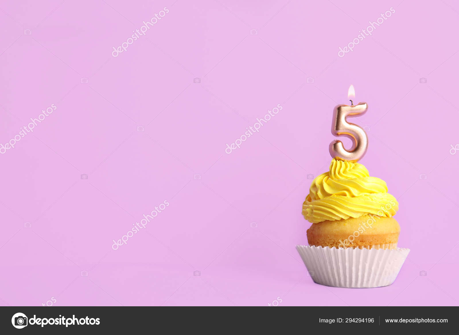 Birthday cupcake with number five candle on violet background, space ...