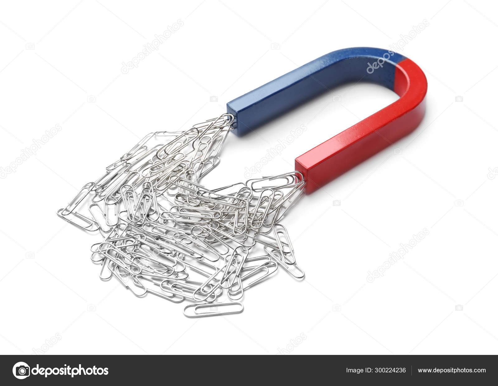 Magnet attracting paper clips on white background — Stock Photo ...
