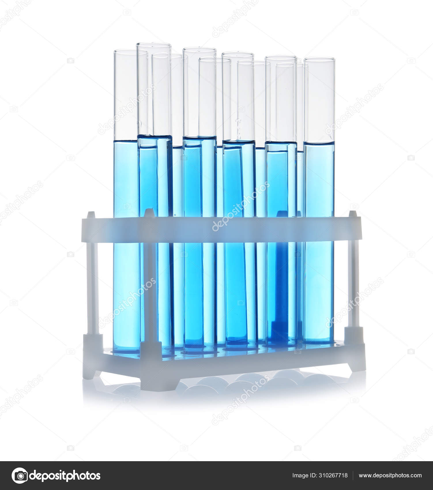 Test tubes with blue liquid on white background. Laboratory glassware ...