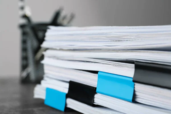 Stack of documents with binder clips on marble table, closeup Stock ...