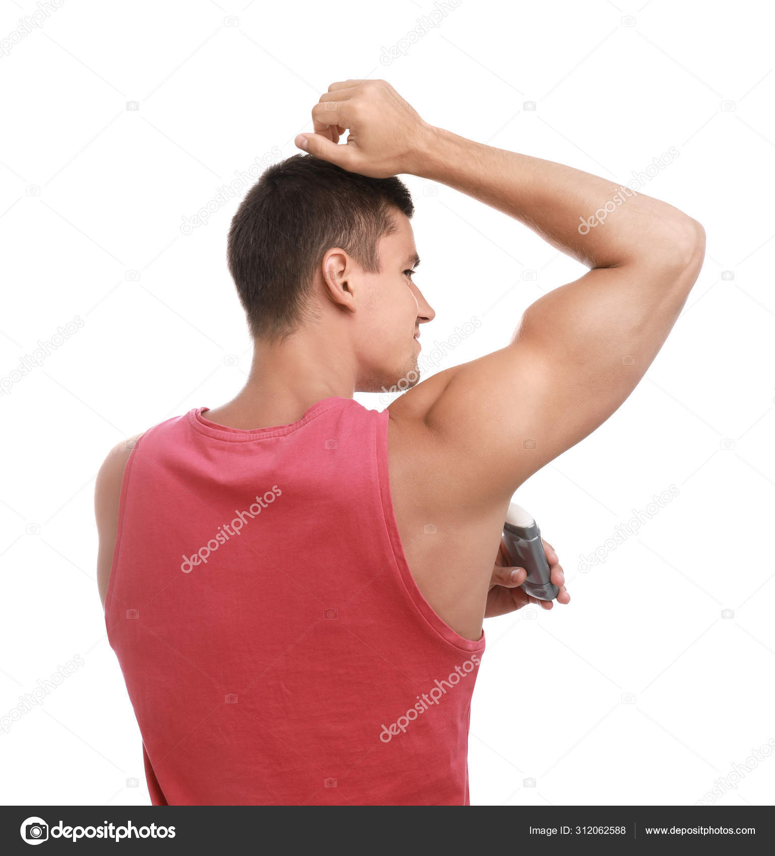 Boy Putting On Deodorant