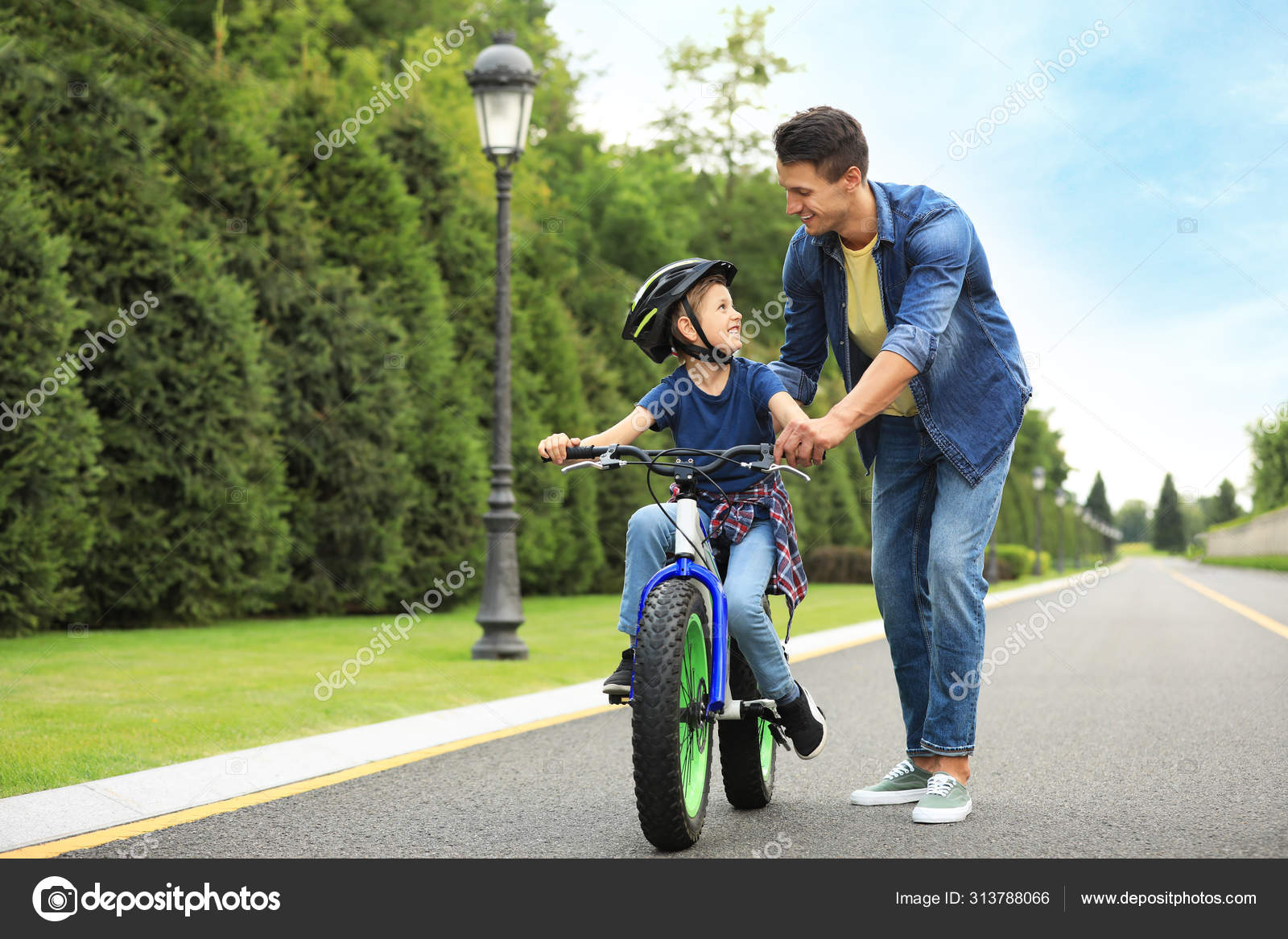 Dad Teaching Son To Ride Bike