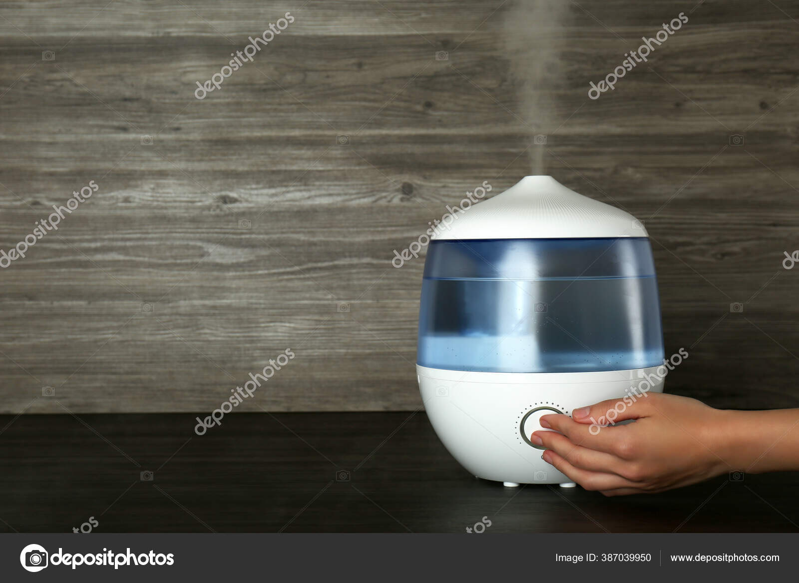 Woman Using Modern Air Humidifier Wooden Table Closeup Space Text ...