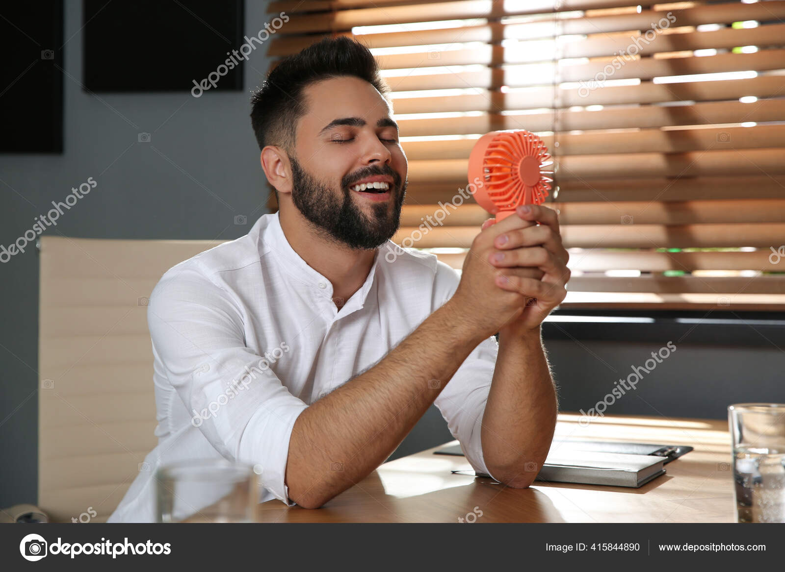 Man Enjoying Air Flow Portable Fan Workplace Summer Heat Stock Photo by ...
