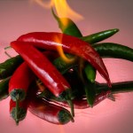 Flying red hot chilli peppers with flames Stock Photo by ©jag_cz 301580488