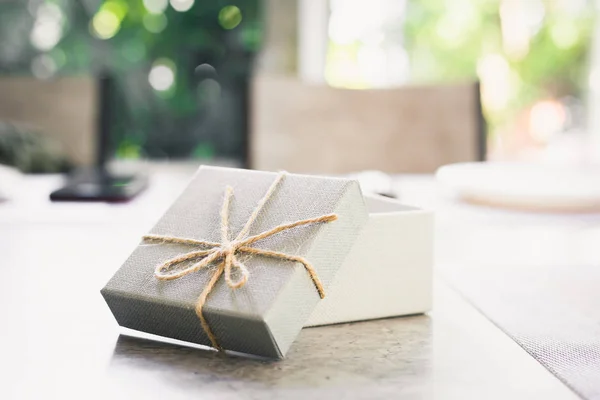 open empty gift box on table. A present on holiday. - Stock Image ...