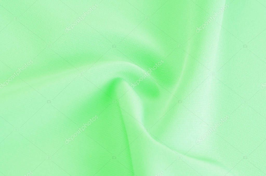 Textura, fondo, patrón. La textura de la tela es verde lima pálido ...