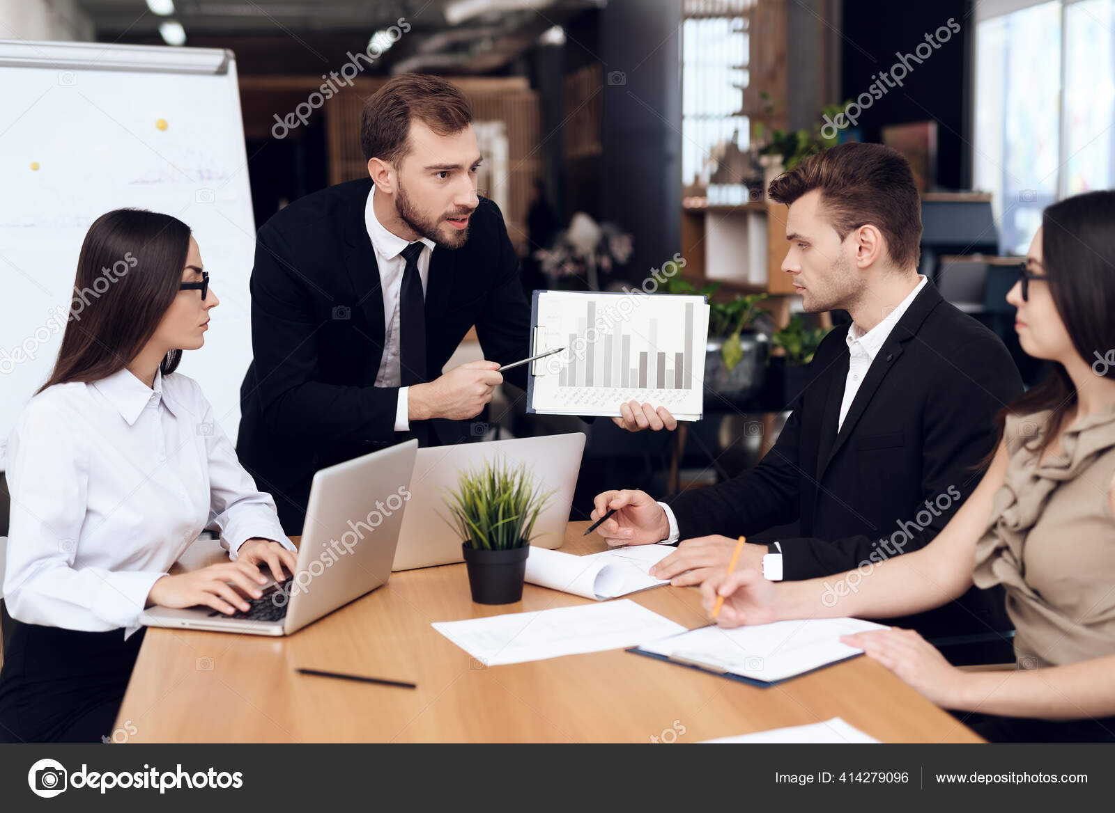 A strict director shows his employees a schedule. — Stock Photo ...