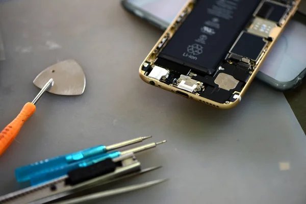 Close-up Of A Human Hand Repairing Smartphone With Screwdriver.Internal ...