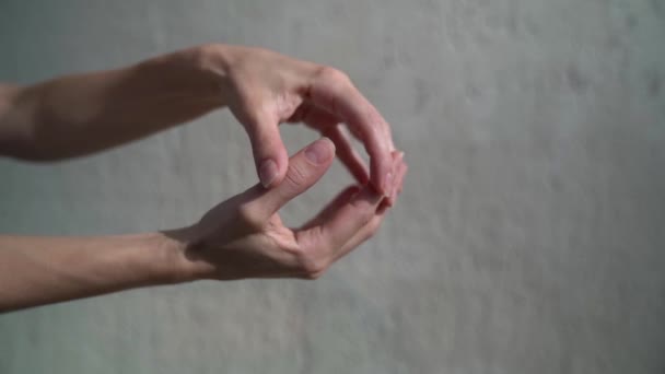 Woman is clenching her hands, making fist, closeup of palm ...