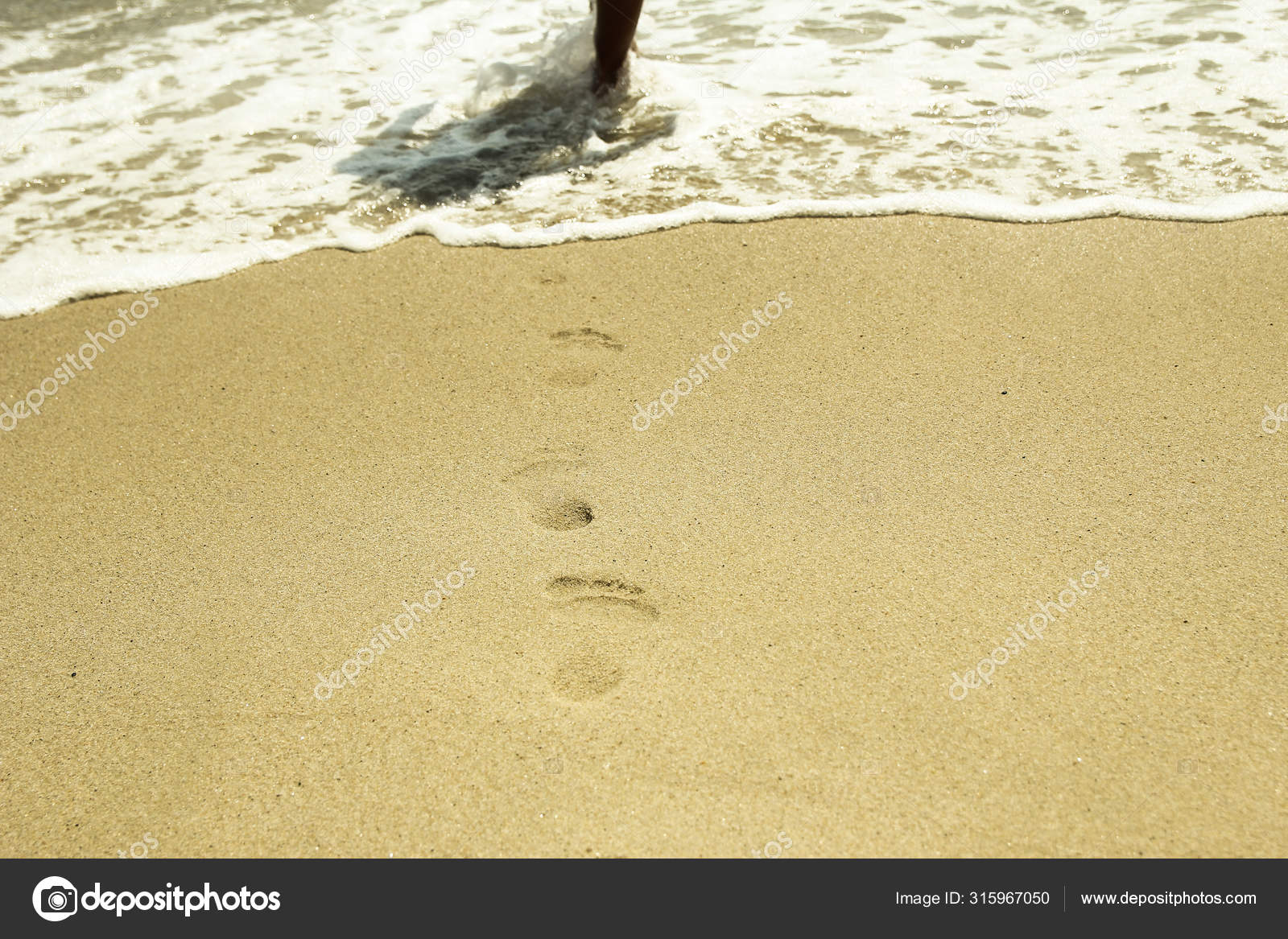 Footprints in the sand on the beach — Stock Photo © Kostia777 #315967050