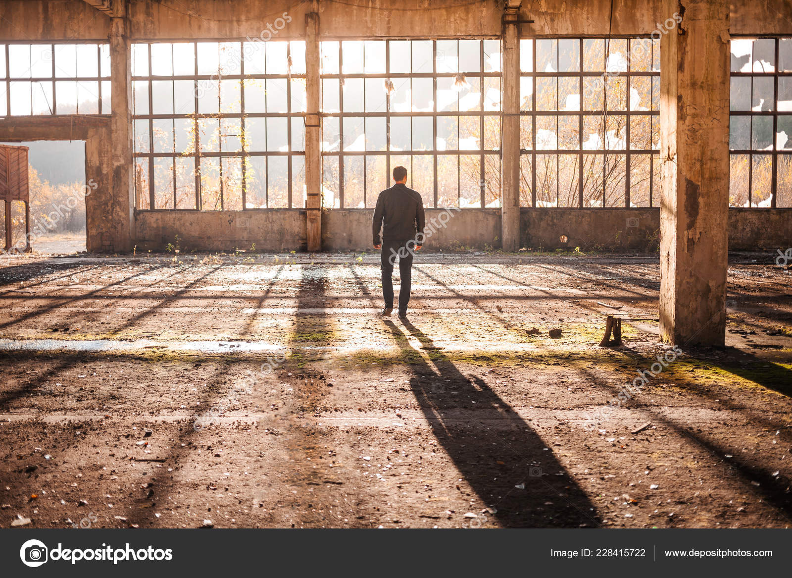 Handsome Man Walk Thru Empty Factory — Stock Photo © hawk_style #228415722