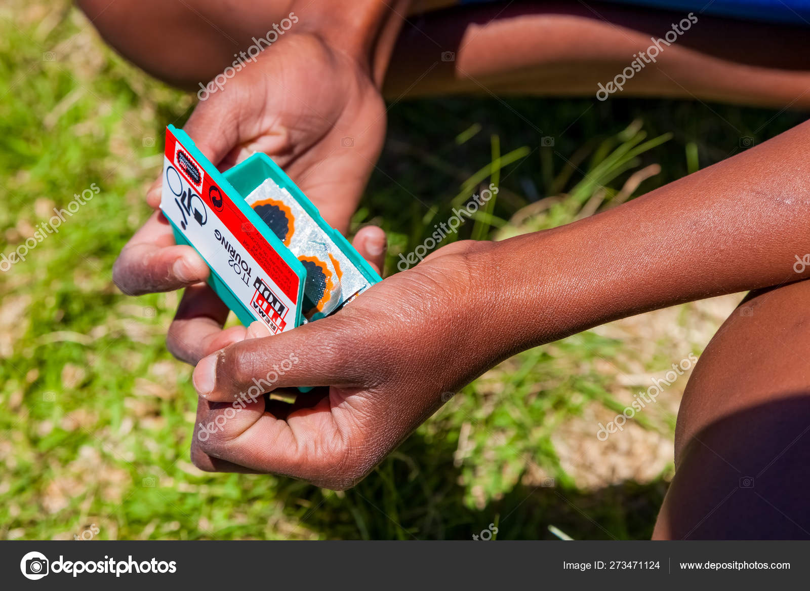 African Children fixing a puncture on a bike – Stock Editorial Photo ...