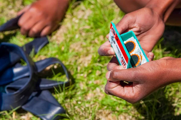 African Children fixing a puncture on a bike – Stock Editorial Photo ...