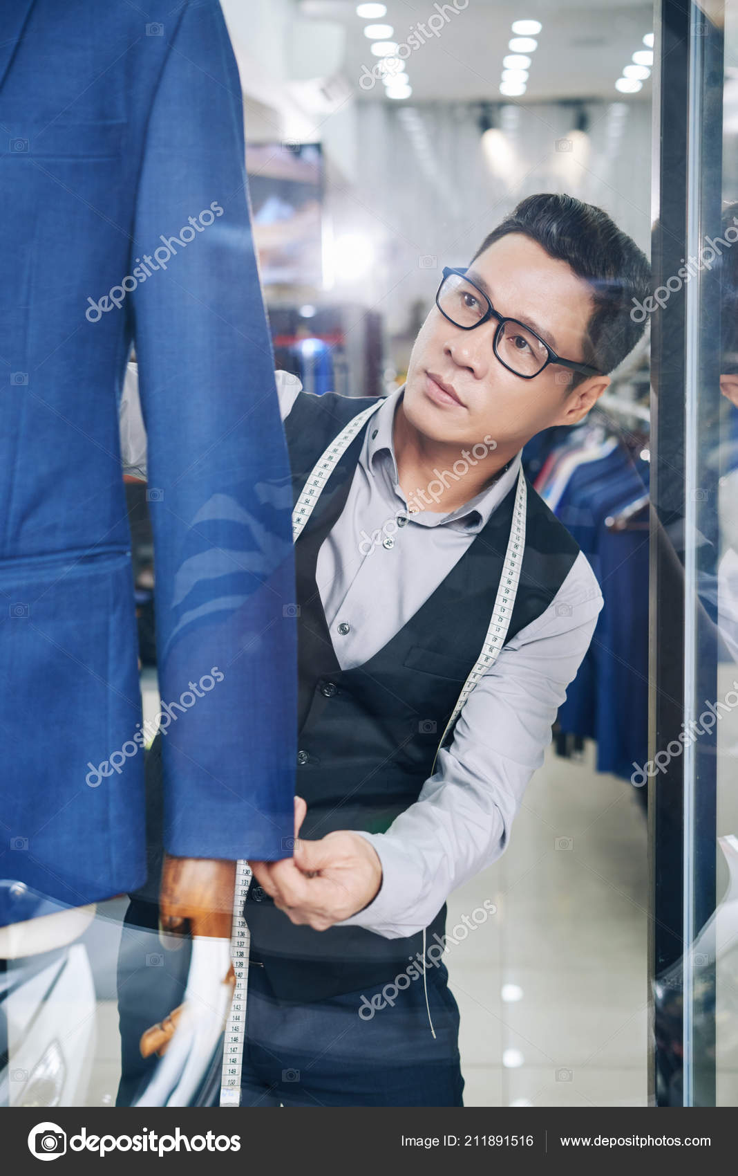Vietnamese Salesman Putting Mannequin Suit Shop Window Stock Photo by ...