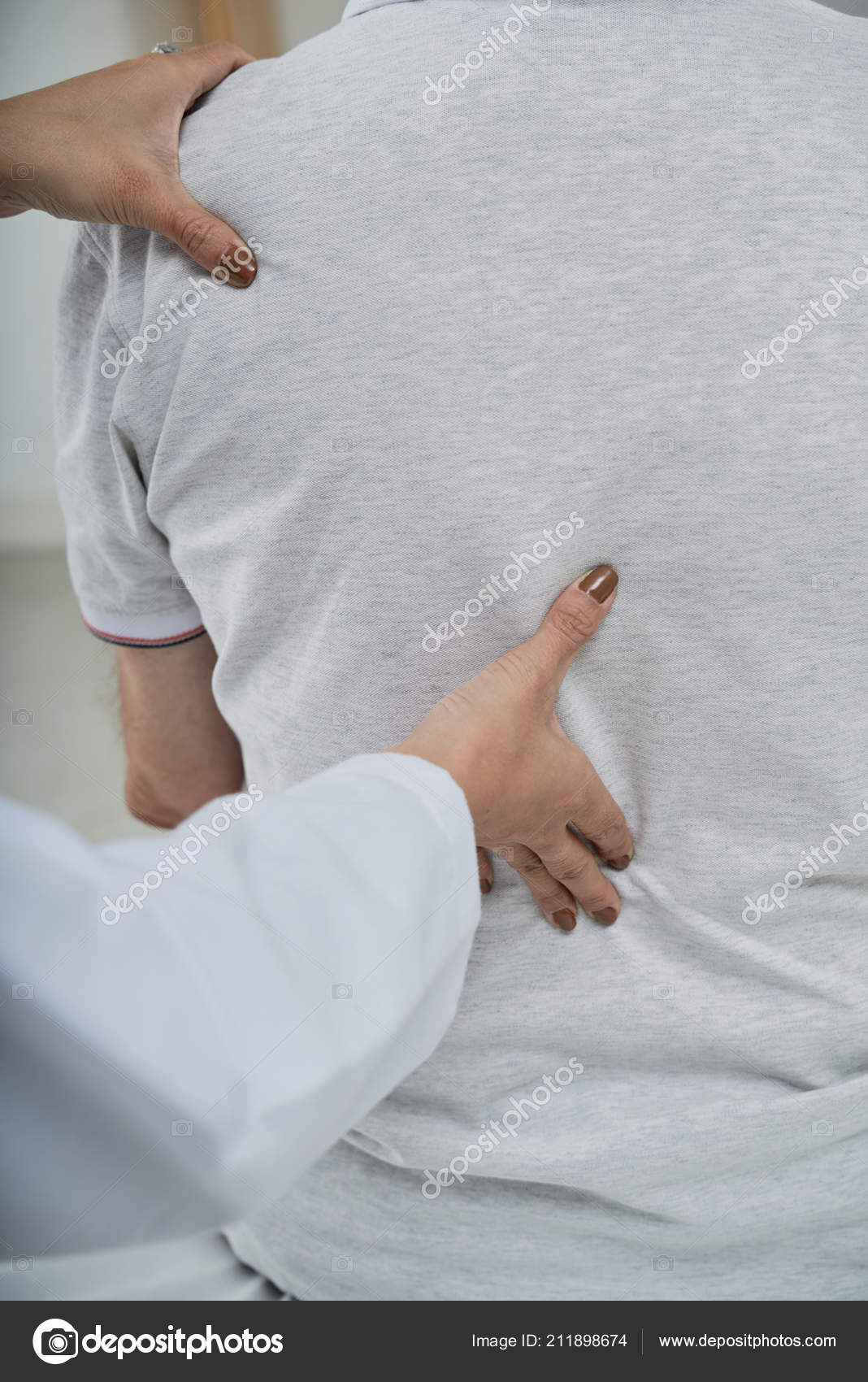 Doctor Checking Back Spine Male Patient Stock Photo by ©DragonImages ...