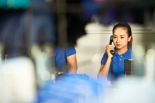Pretty female shop assistant consulting customer on the phone - Stock ...
