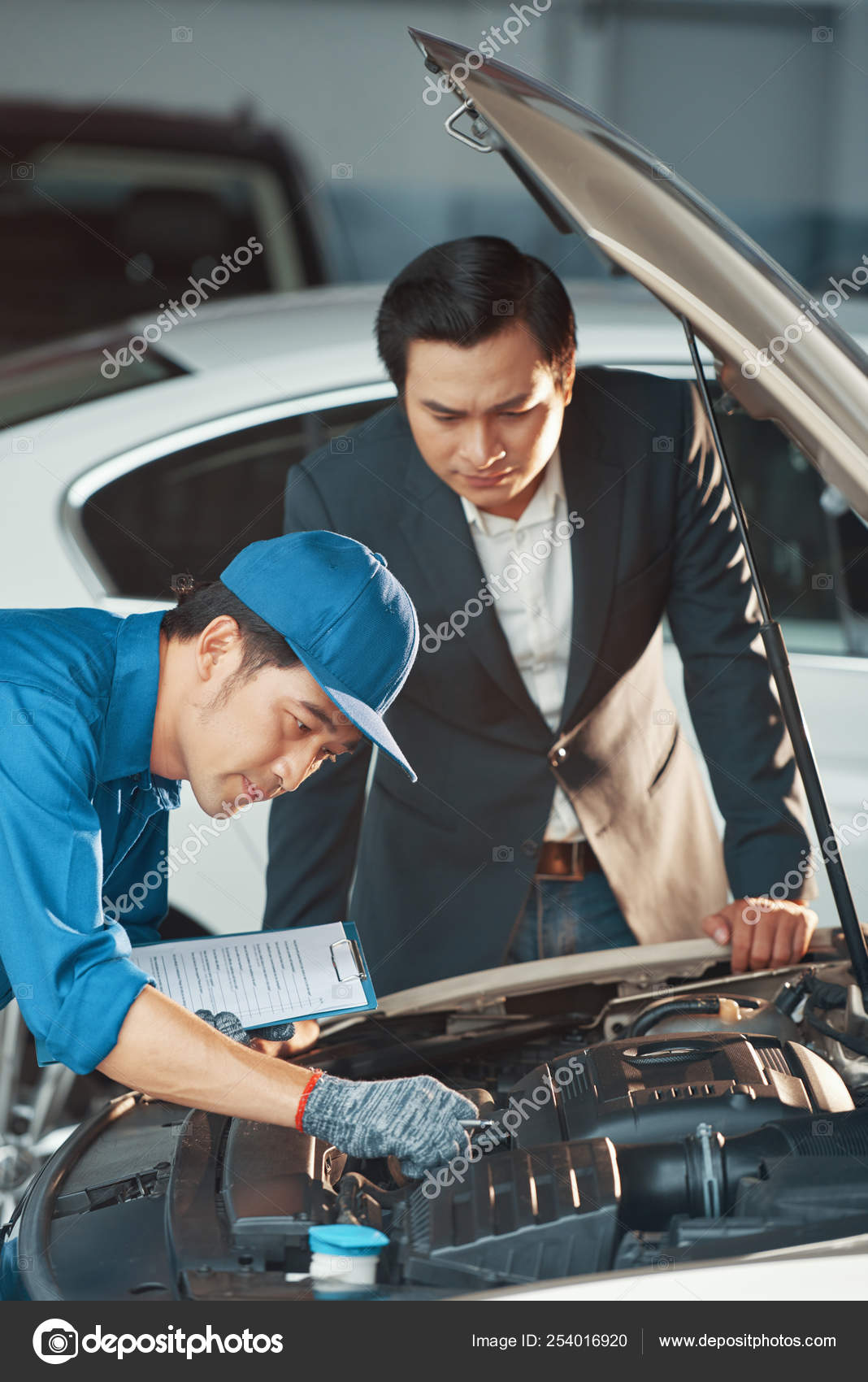 Car Service Workshop Garage Mechanic Worker Repairing Vehicle Car Owner ...