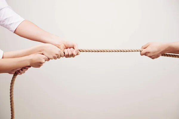 Man and woman pulling rope Stock Photo by ©NatashaFedorova 149288034