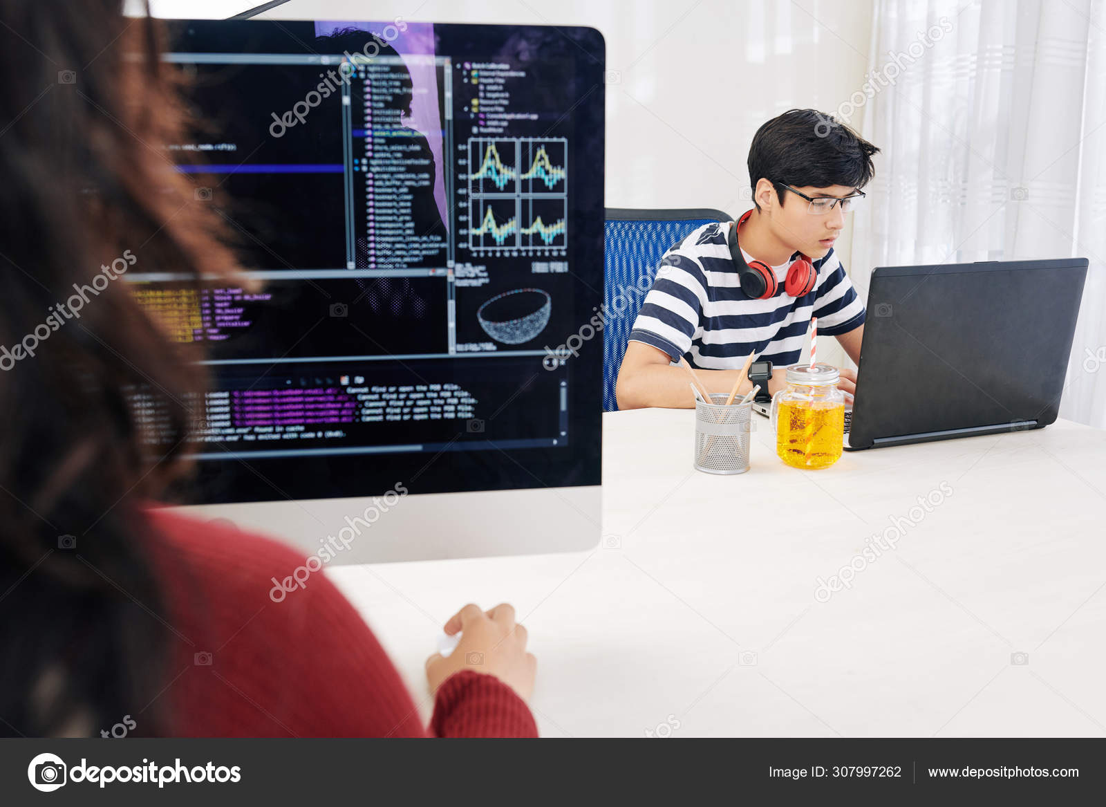 Concentrated Asian Teenager Programming Laptop Office His Female Friend ...