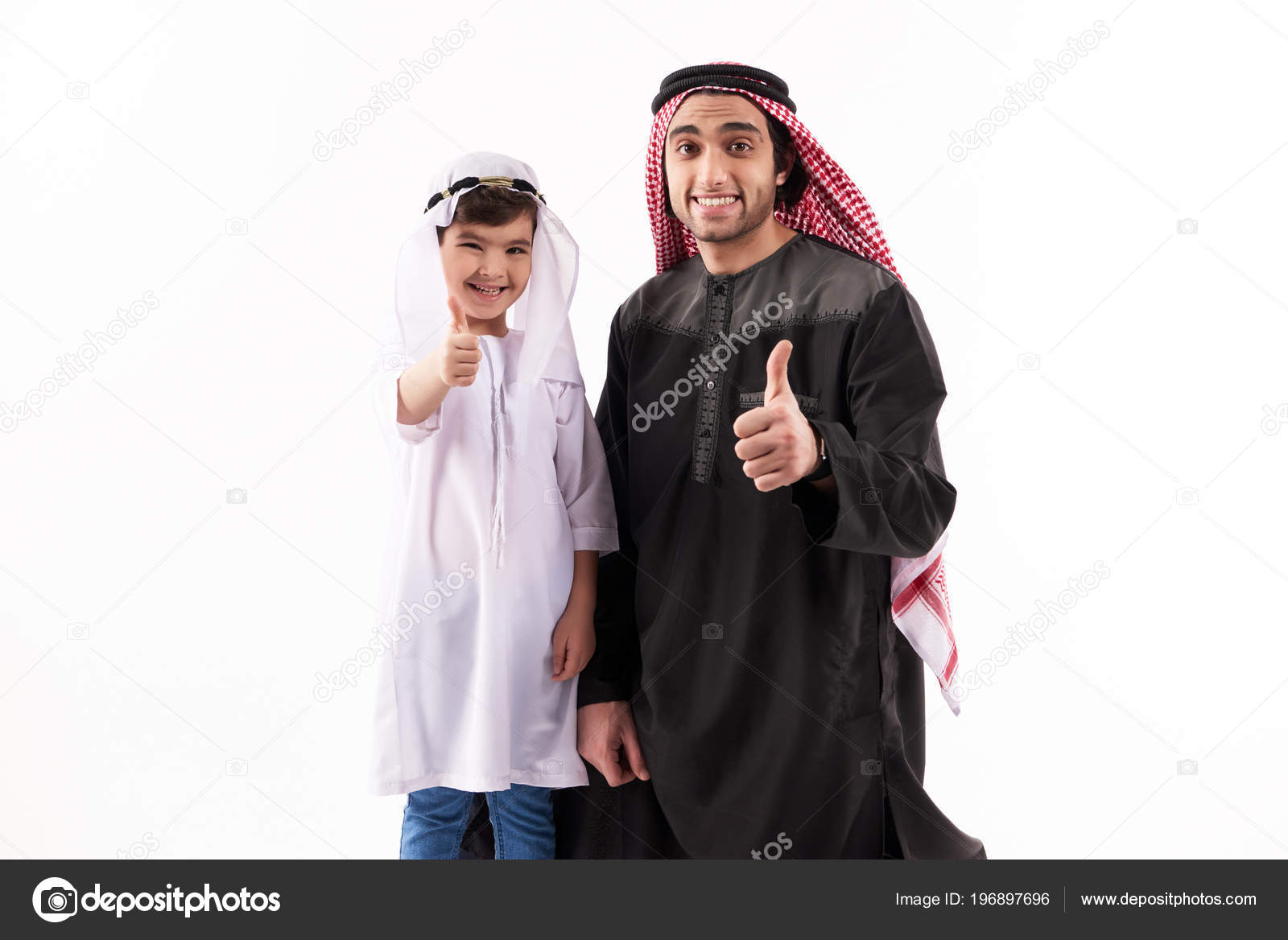 Arab father and son in ethnic clothes — Stock Photo © stockveres.gmail ...