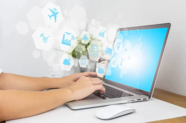 Hand pressing modern laptop with Internet of things (IOT) objects icon ...