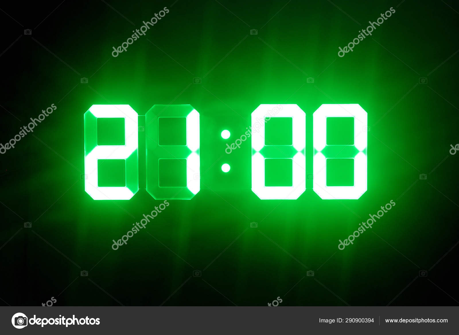 Green glowing digital clocks in the dark show 21:00 time — Stock Photo ...