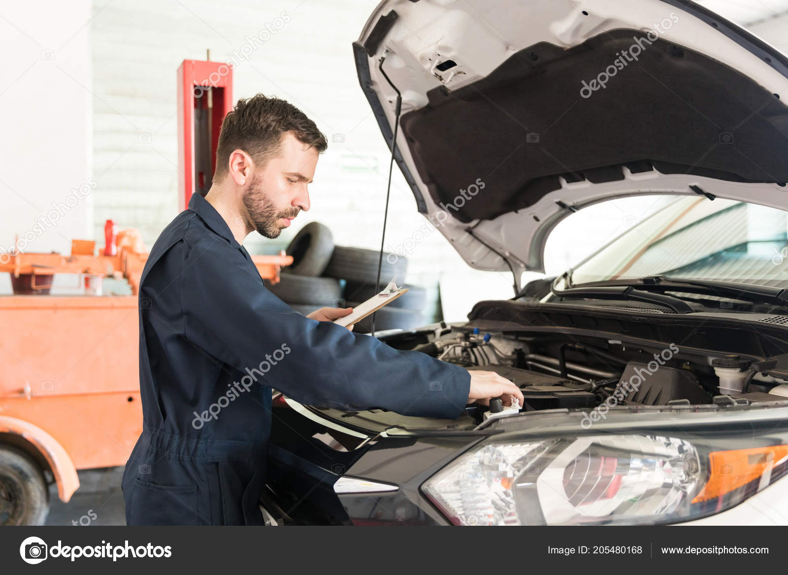 Side View Male Auto Mechanic Checklist Examining Car Engine Repair ...
