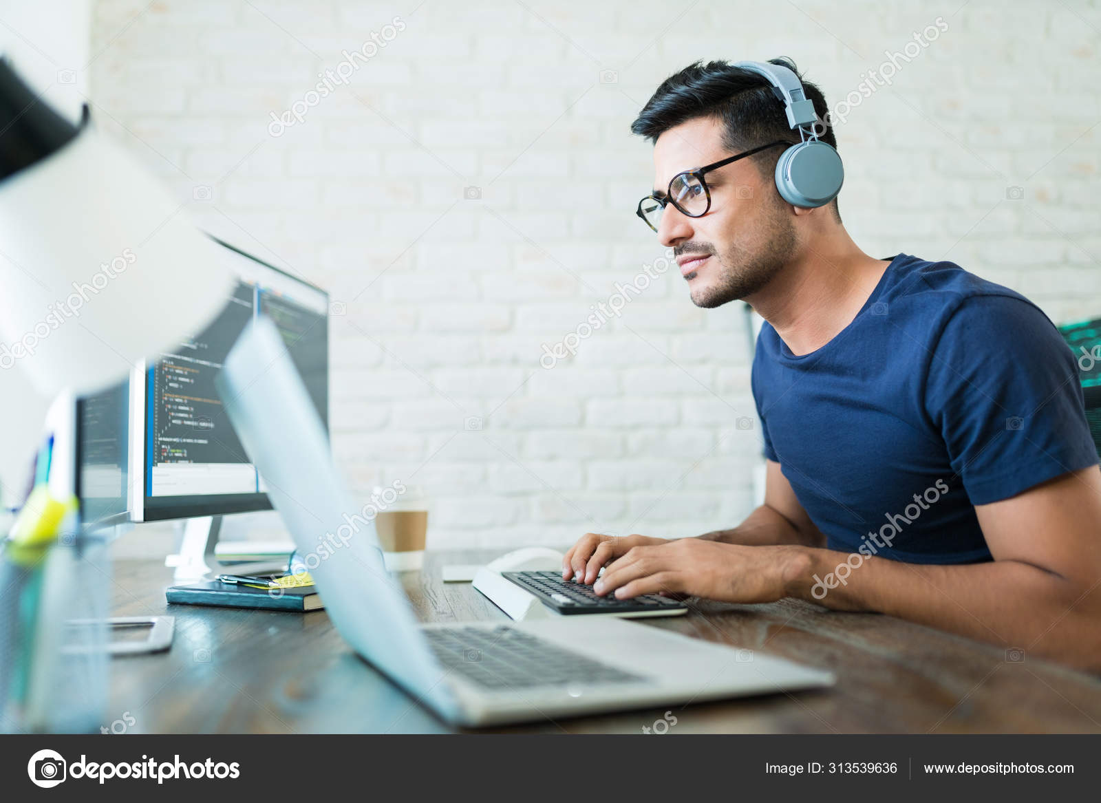 Handsome Young Male Software Developer Programming Codes While Working ...