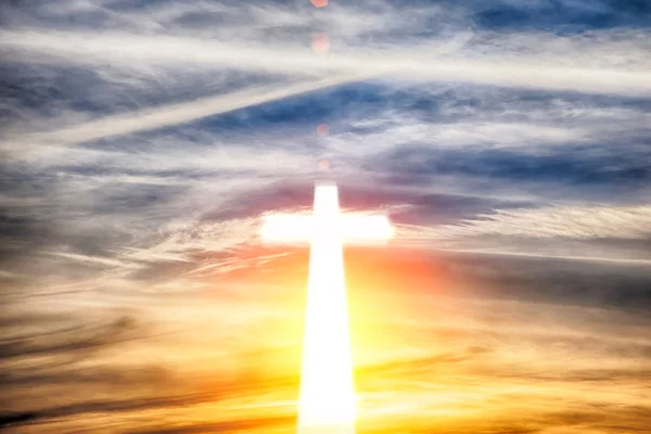 Glowing cross on beautiful sky background - Stock Image - Everypixel