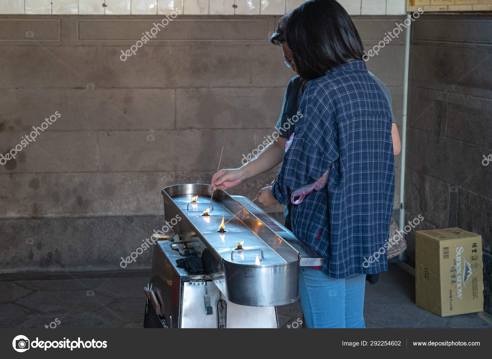 Believers piously worship in the Bangka Longshan Temple. Is a Chinese ...