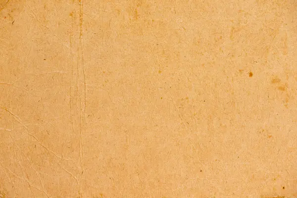 Old yellow craft paper background — Stock Photo © rnax #381293084