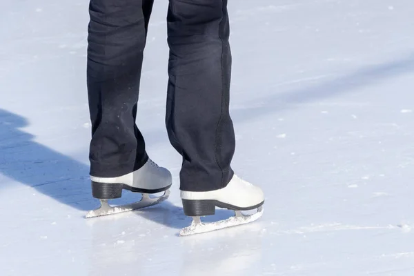 Ice skating, woman legs wearing white leather skates, training on a ...