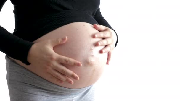 Close up pregnant woman showing her belly to the camera — Stock Video ...