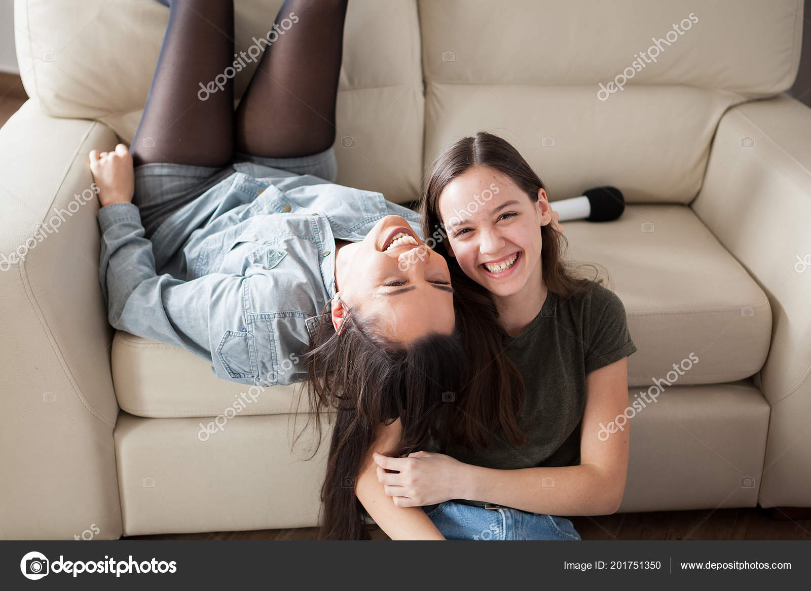 Candid photo of two sisters laughing — Stock Photo © DragosCondreaW ...