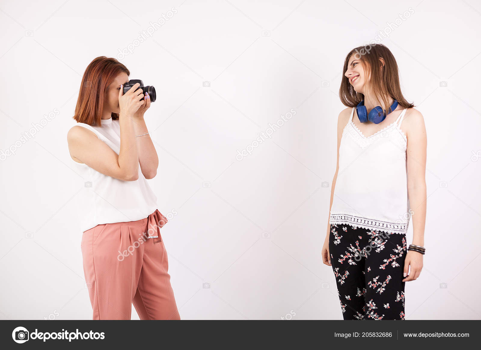 Woman photographer and her female friend taking pictures — Stock Photo ...
