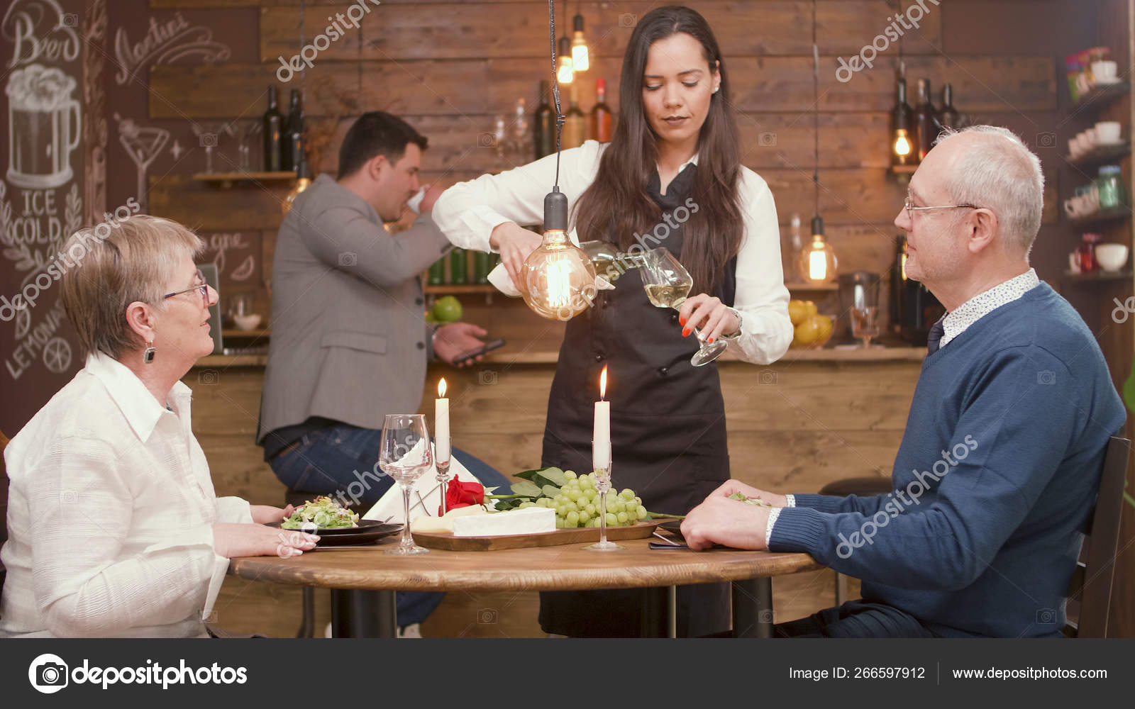 Beautiful couple in their sixties having dinner in a restaurant ...