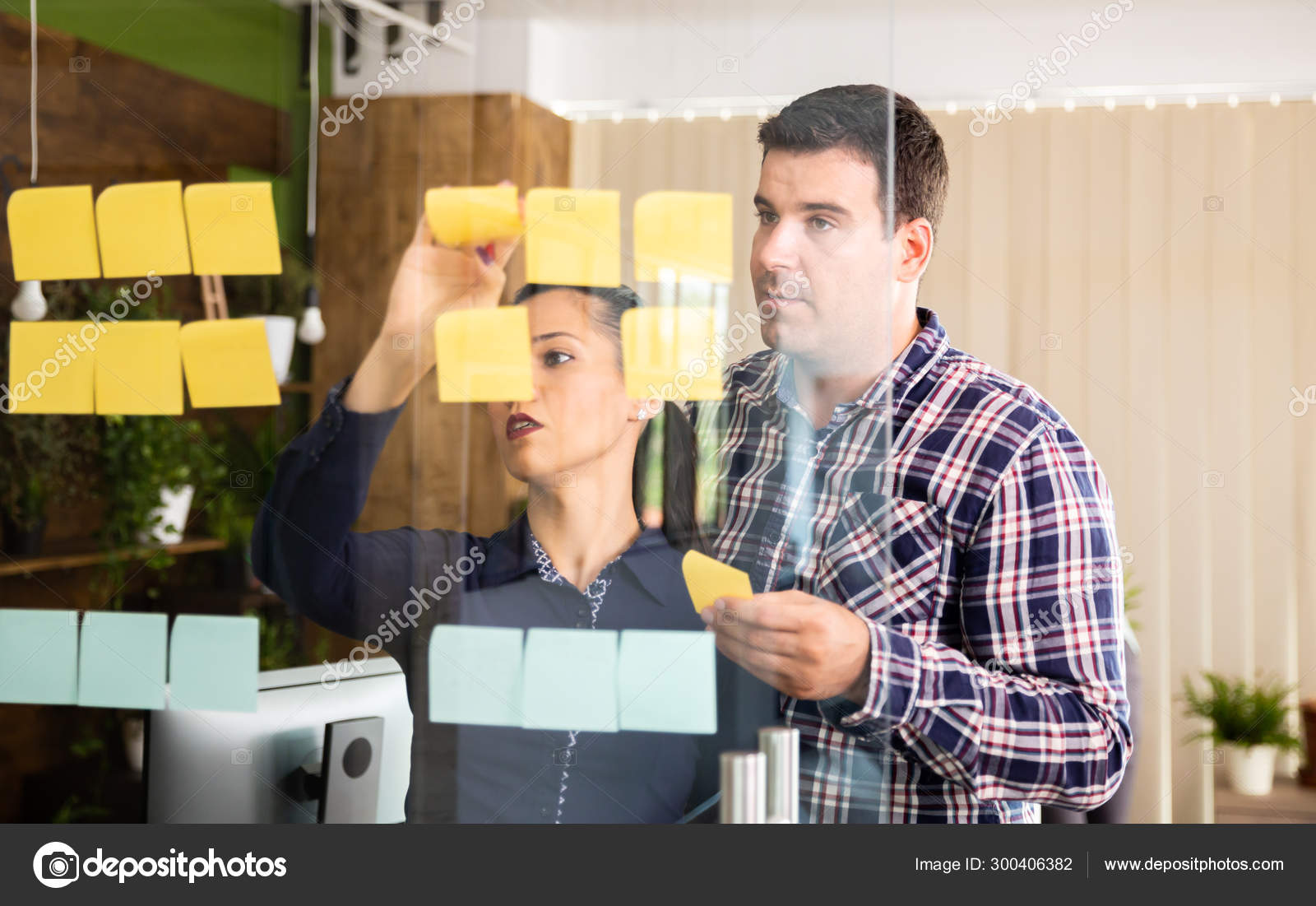 Young people plan a new project in front of a note glass — Stock Photo ...