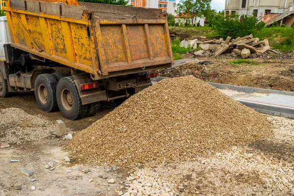 dump truck poured a bunch of rubble at the construction site - Stock ...