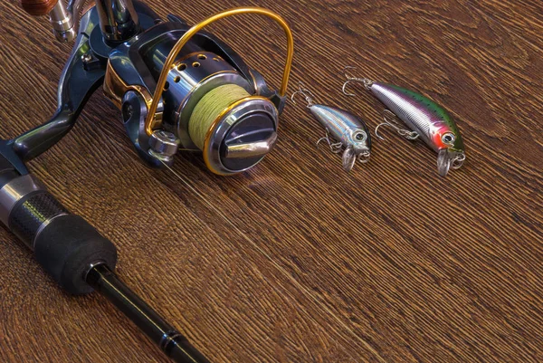 Fishing tackle - fishing spinning, hooks and lures on darken woo ...