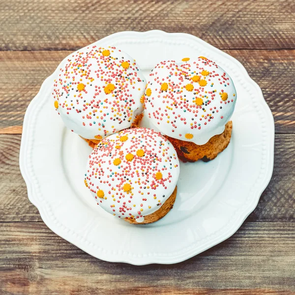 Happy Easter cake with sprinkles on white glaze. Easter cake on old ...