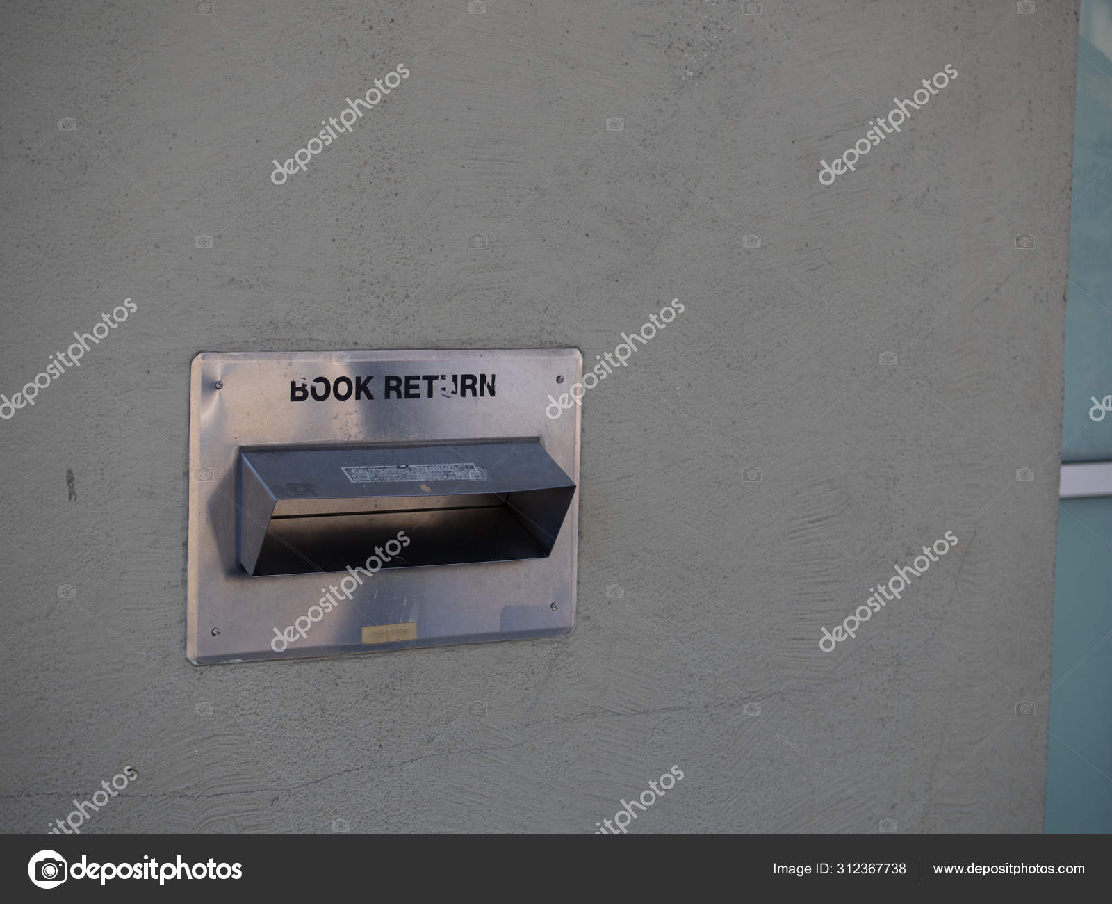 Book return metal slot outside of a public library building — Stock ...