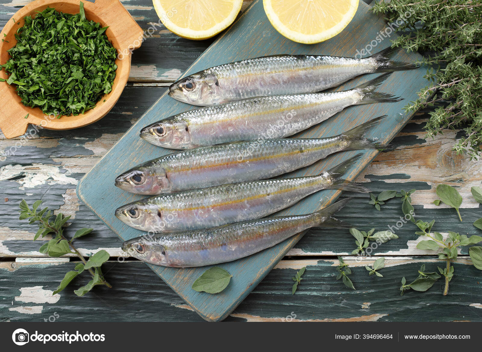 Blue Fish Raw Pilchard Green Table Background Stock Photo by ©denio109 ...